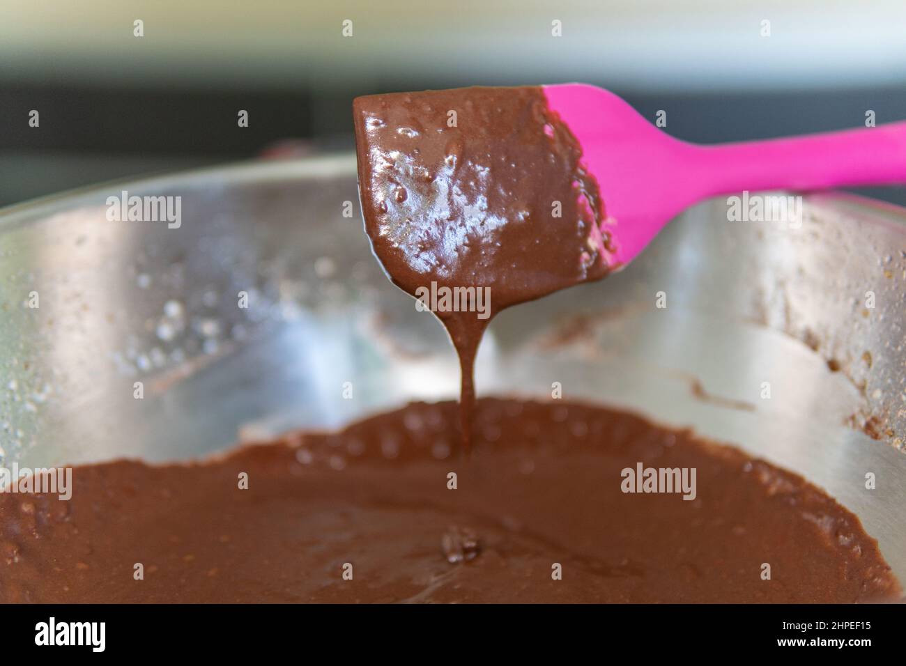 mixing those baking ingredient on a bowl and mixing using hand for ...