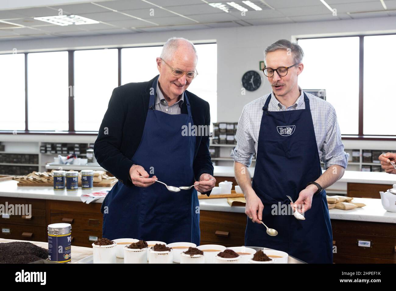 EDITORIAL USE ONLY Jim Broadbent is given an introduction to the tea ...