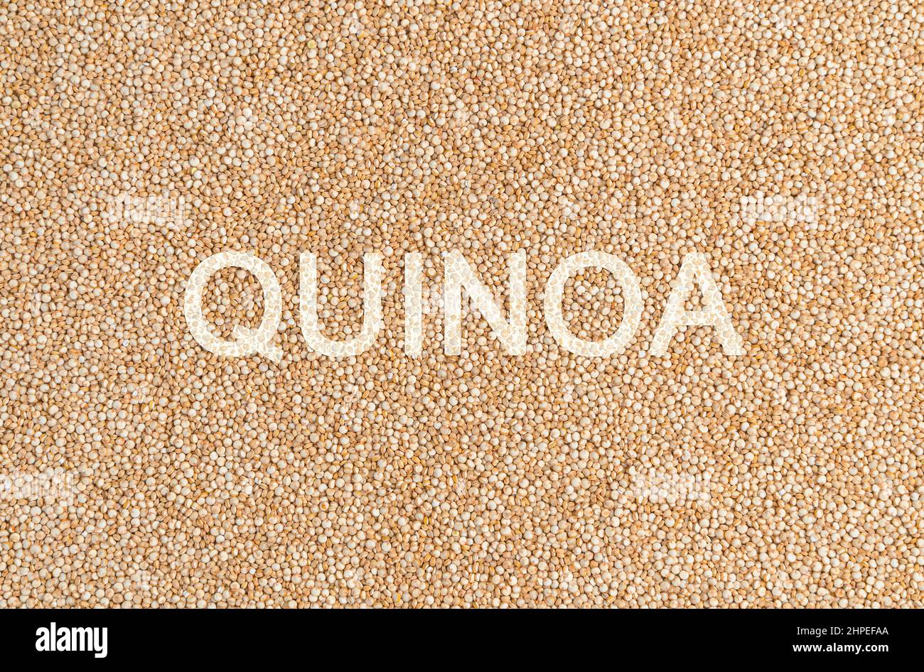 Culinary background, beige quinoa seeds. Healthy food. Horizontal view ...