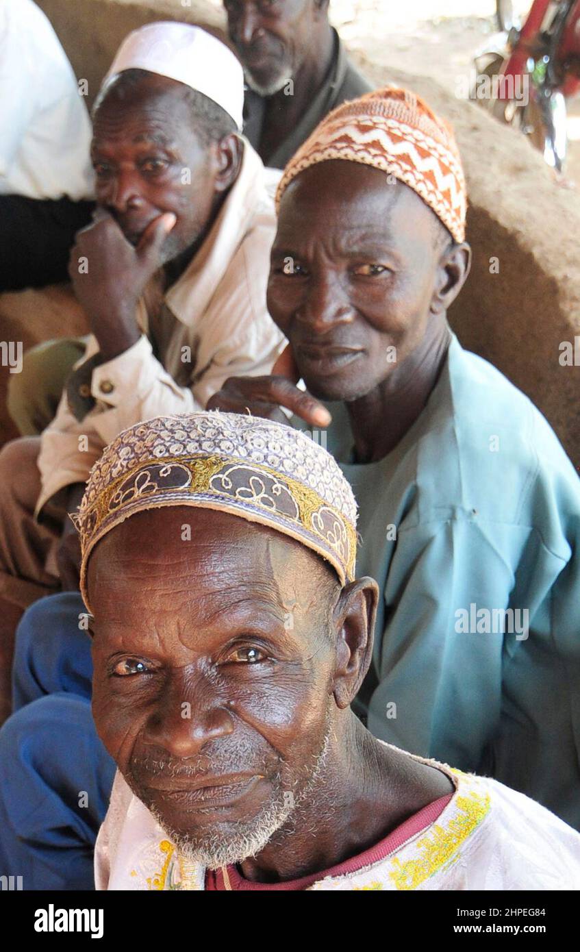 Elderly Mossi men socializing in their village in central Burkina Faso ...