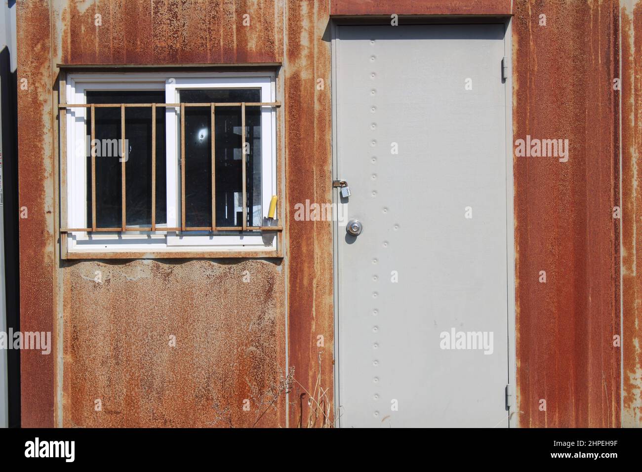 Front entrance of rusty shipping container house Stock Photo - Alamy