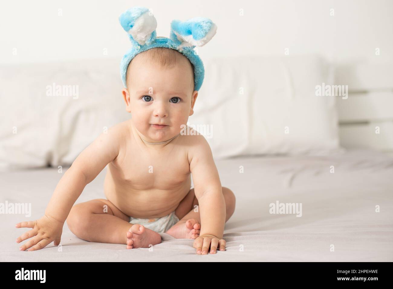 Boy dressed as bunny and Easter eggs Stock Photo - Alamy