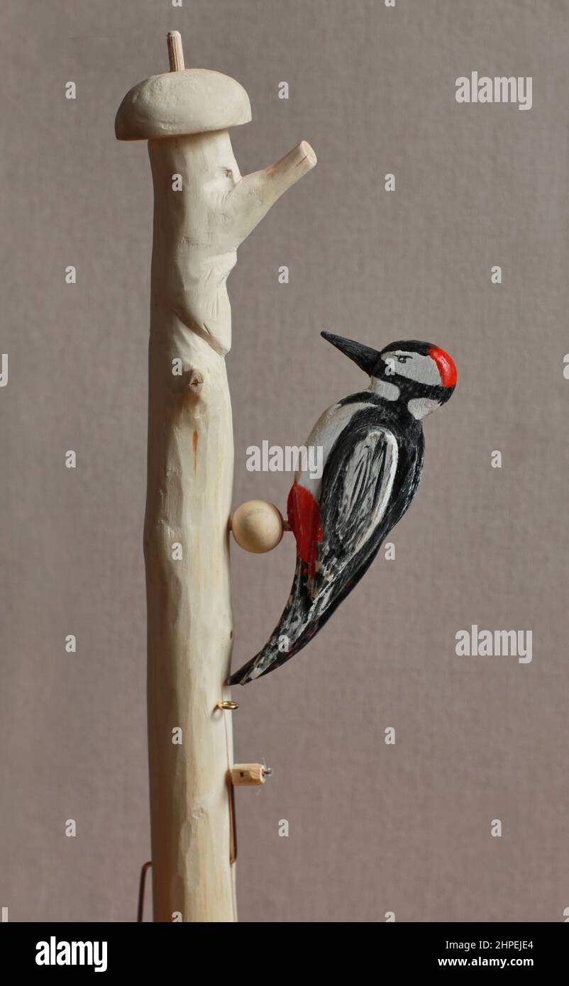 red-headed woodpecker figurine wooden toy close-up Stock Photo - Alamy