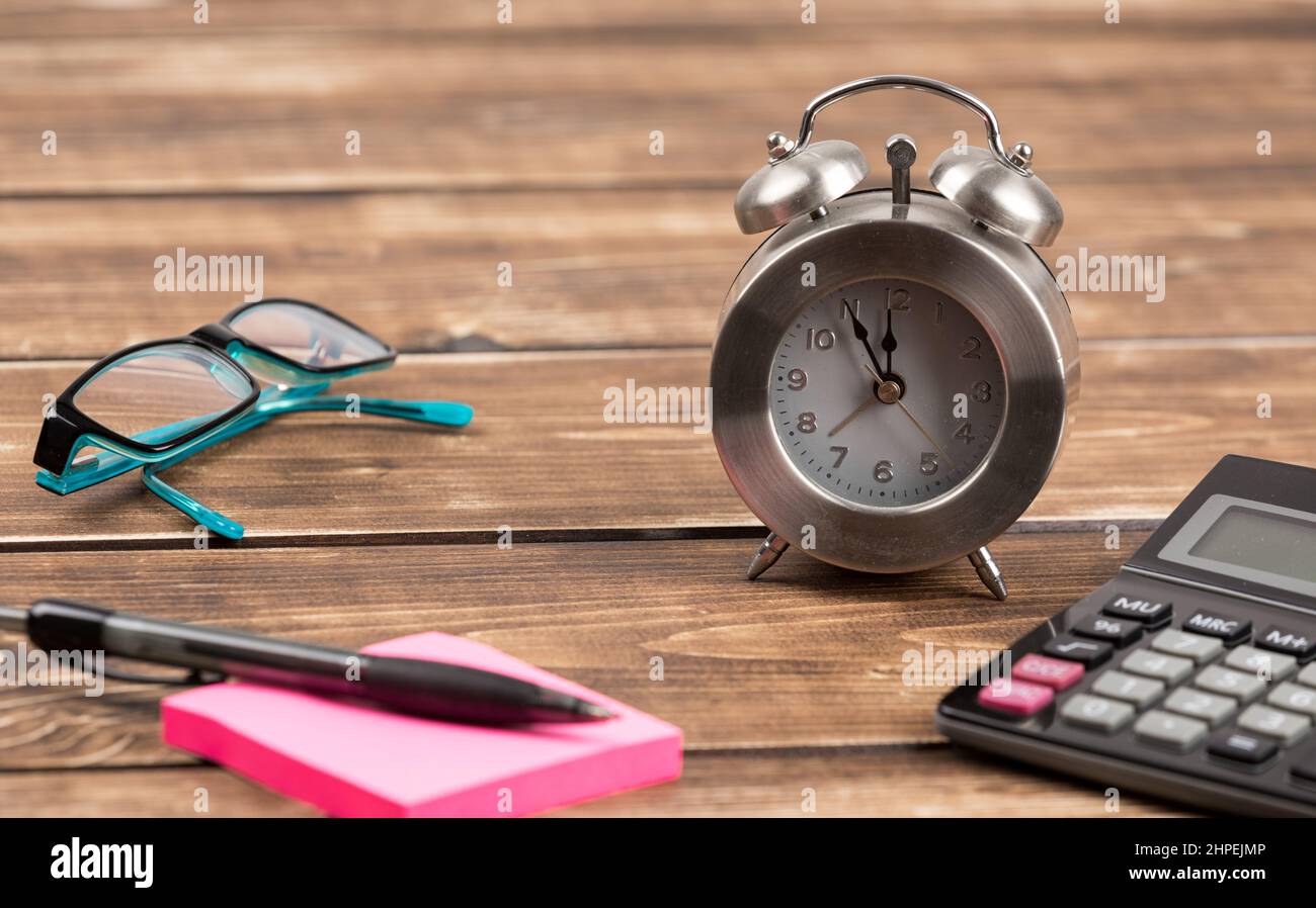 Office desk with calculator, pen, and different objects Stock Photo - Alamy
