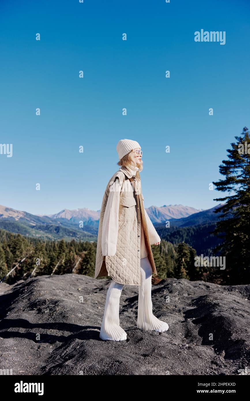 young woman standing on the top of the mountain forest lifestyle Stock ...