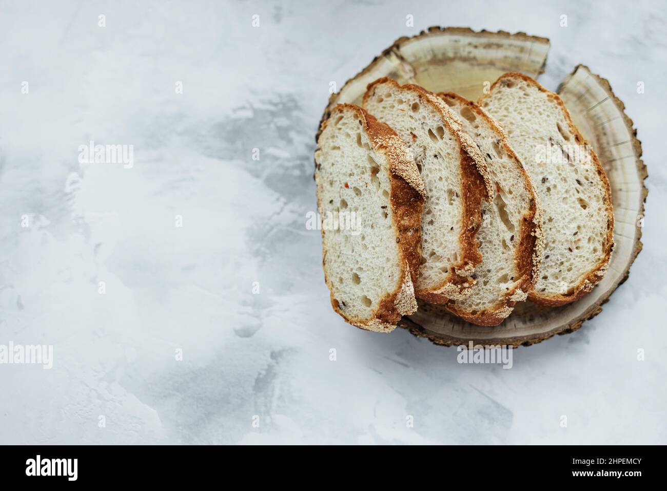 Sliced breads put on wooden board, whole wheat breads on background ...