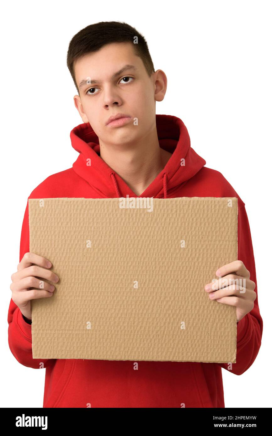 Bored exhausted teenage boy holding blank brown cardboard banner, tired ...