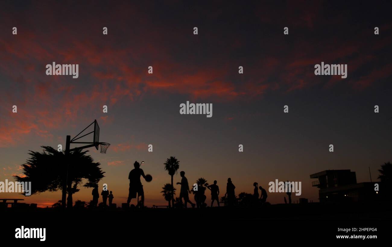 Silhouettes basketball players sunset hi-res stock photography and ...
