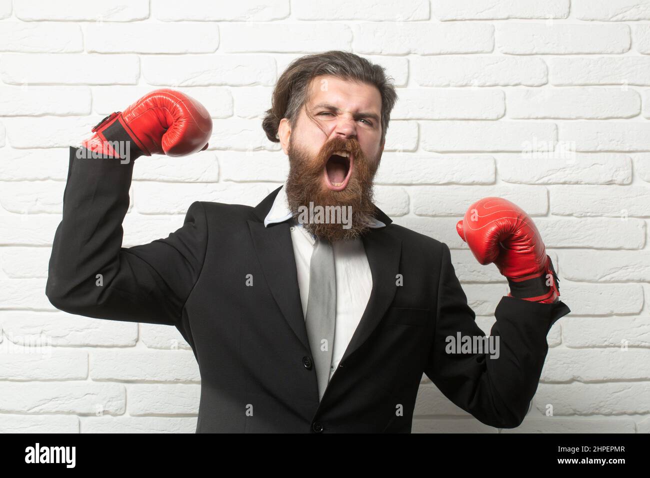 Crazy man boxing. Funny excited boxer businessman. Young man in a suit ...