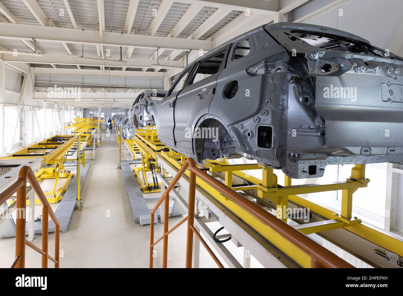 Car bodies are on assembly line. Factory for production of cars. Modern ...