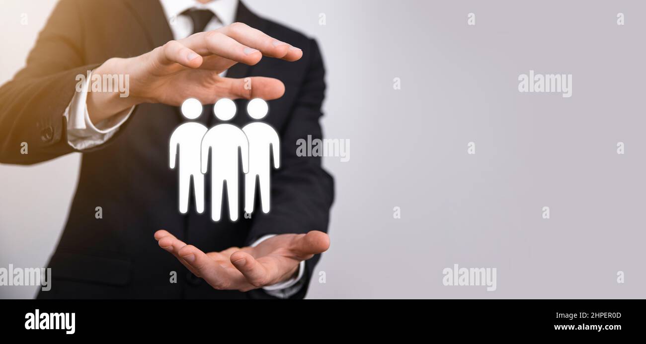 Businessman hold teamwork icon. Building a strong team. people icon ...