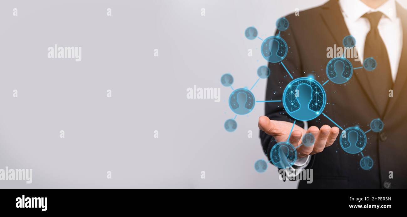 Businessman holding on hand icon of user man,woman low poly polygon ...