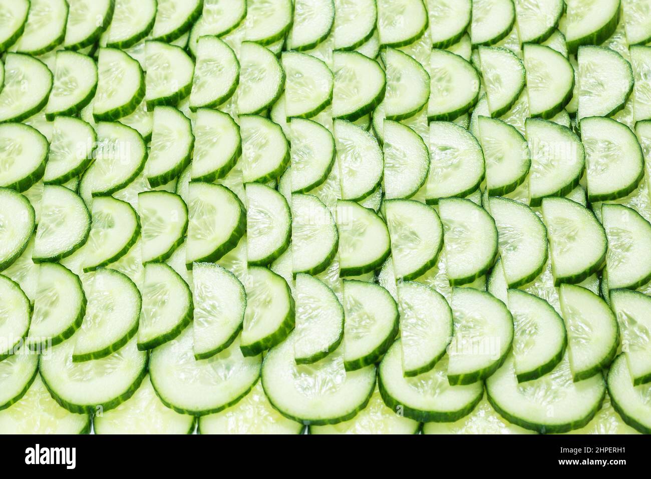 Fresh green slices of cucumber as background. Top view Stock Photo - Alamy