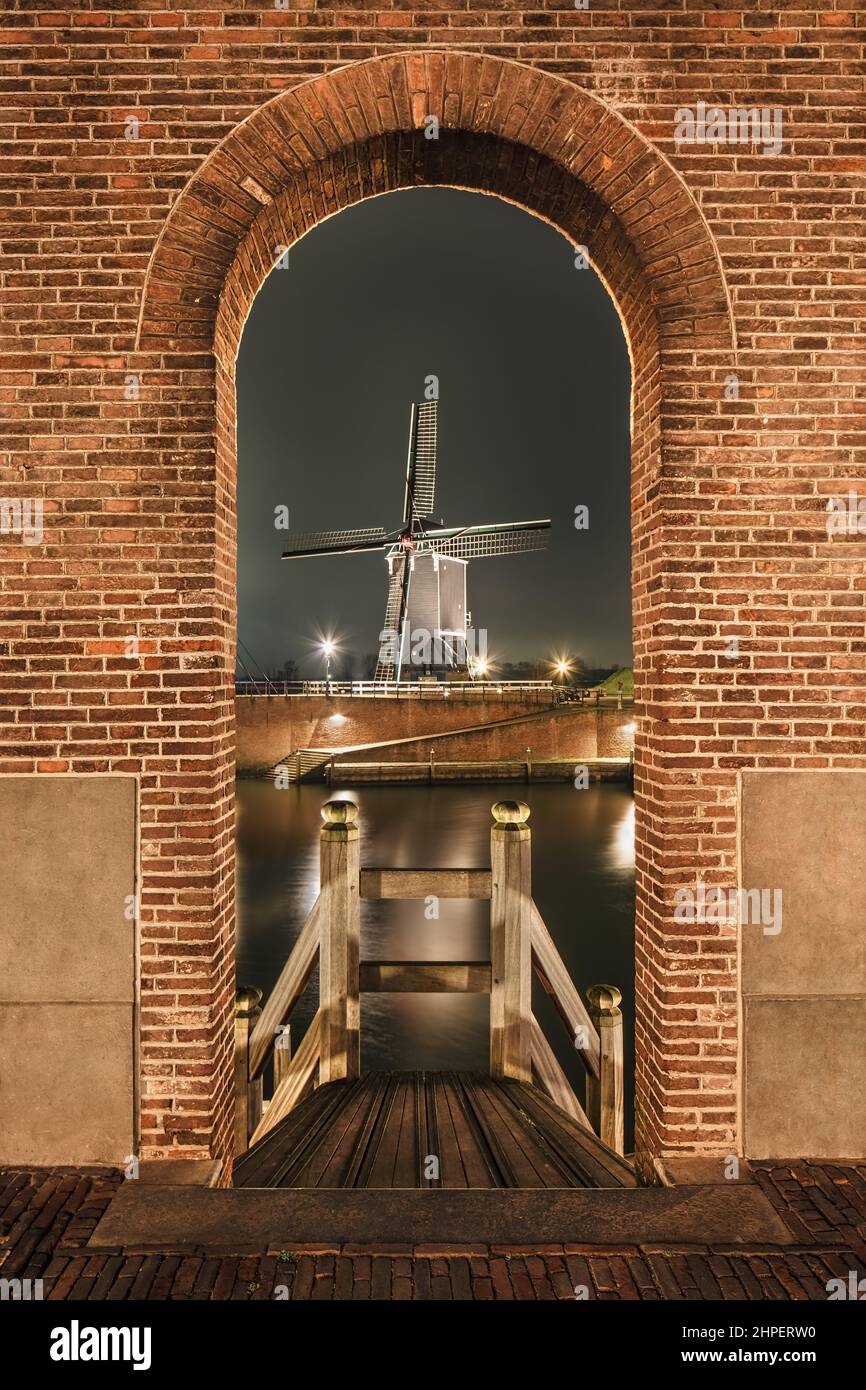 Night scene with sea trough on historical harbor, fortress city of ...