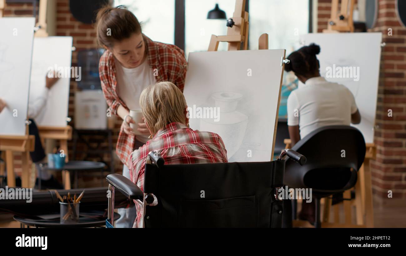Senior person in wheelchair drawing inspiration model in art class ...
