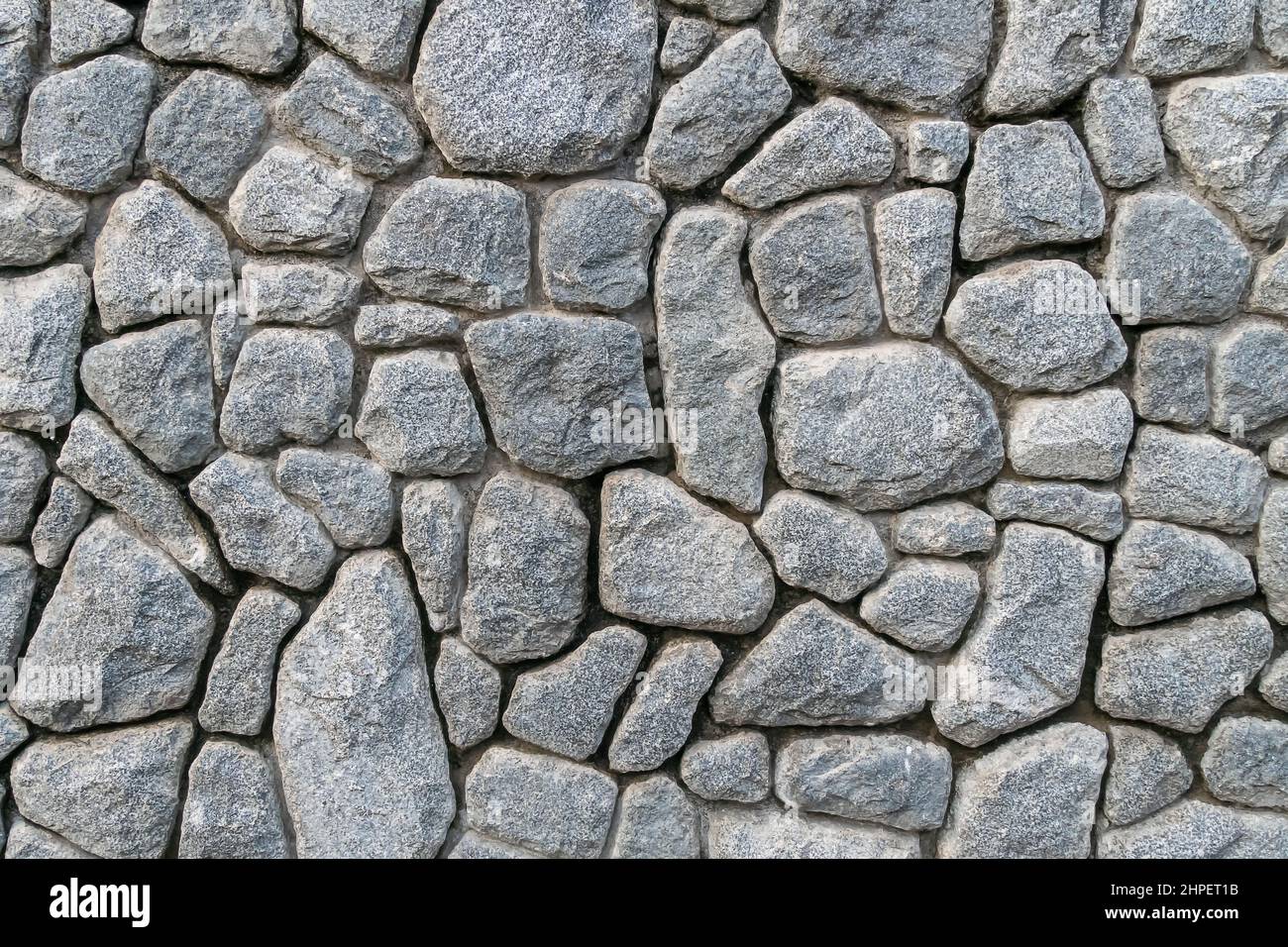 Texture of a gray stone wall. Texture background of the stone wall of ...
