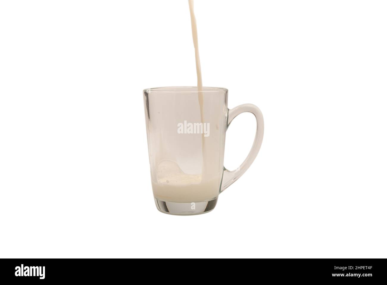 Milk in the cup isolated on white background Stock Photo - Alamy