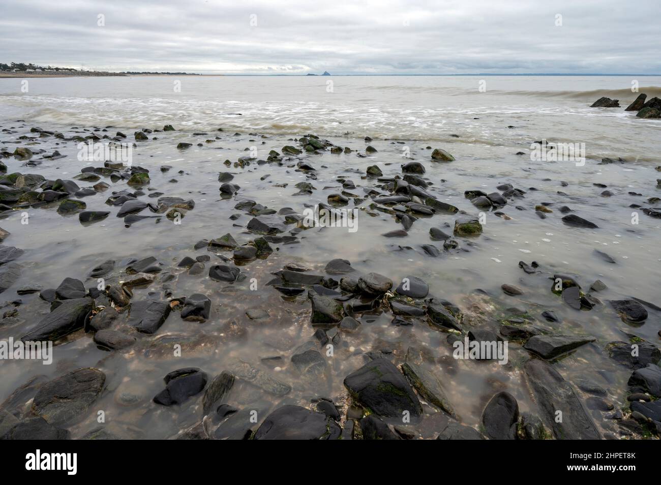Landscape of the wild coast of the French Normandy with clouds and the ...