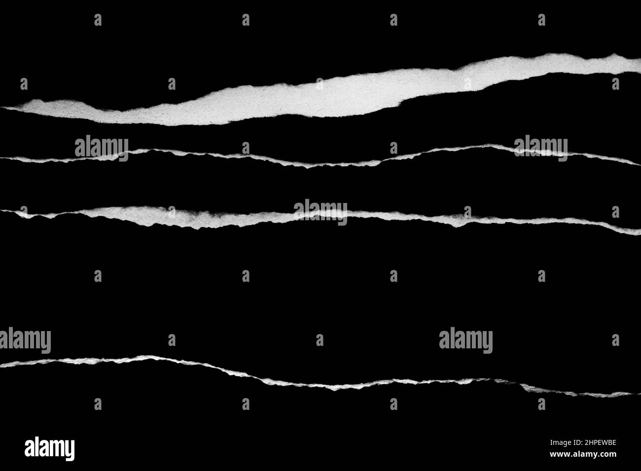 Paper tear, ripped paper edge, torn edge, isolated paper tear white on black, paper corner with ...