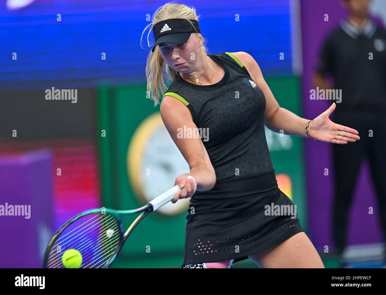 Doha, Qatar. 20th Feb, 2022. Clara Tauson of Denmark returns the ball ...