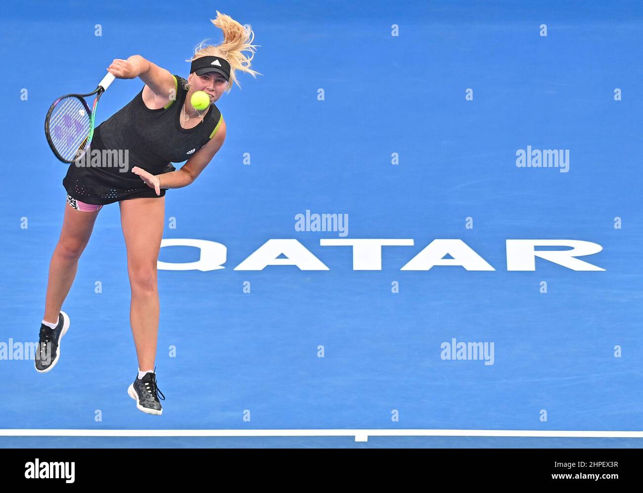 Doha, Qatar. 20th Feb, 2022. Clara Tauson of Denmark serves during the ...