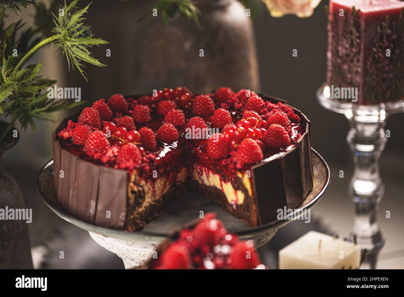 Delicious chocolate vanilla cake with raspberry jelly topping and ...