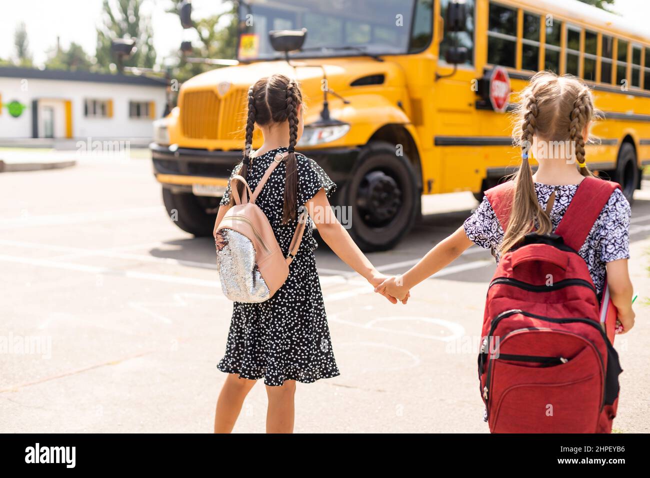 Children running school bus hi-res stock photography and images - Alamy