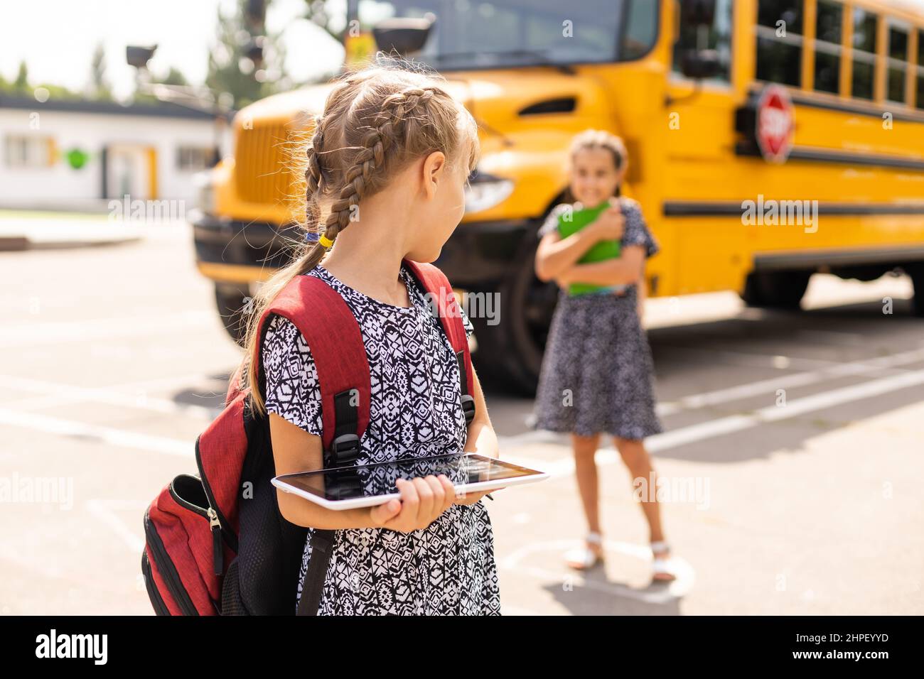 Education: Smiling Student Friends Ready For School next to school bus ...