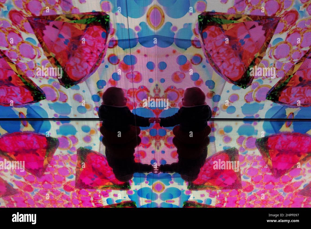 A baby seems mesmerized by the digital immersive art of Studio Irma in ...