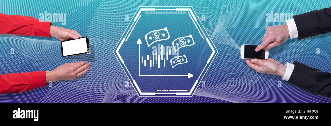 Top view of hands using mobile phone with symbol of stock market ...