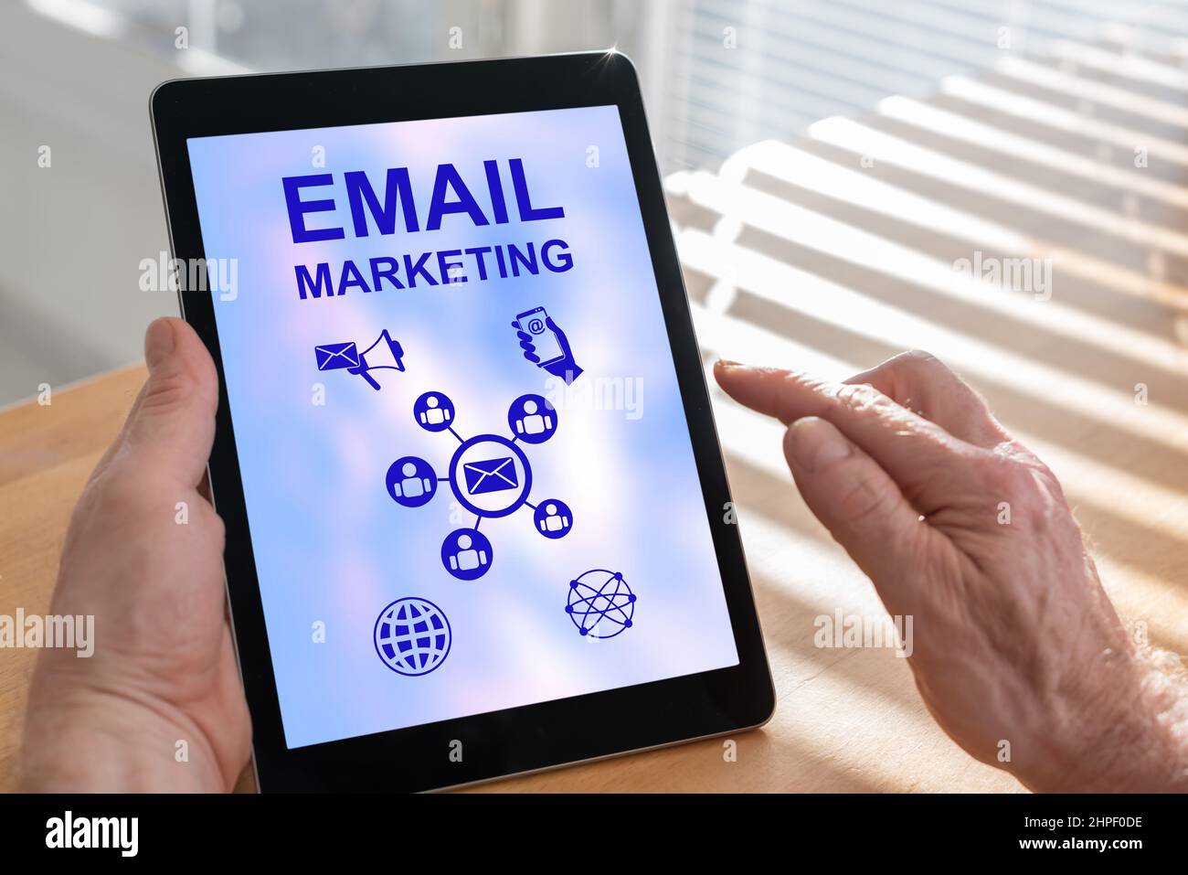 Tablet screen displaying an email marketing concept Stock Photo - Alamy