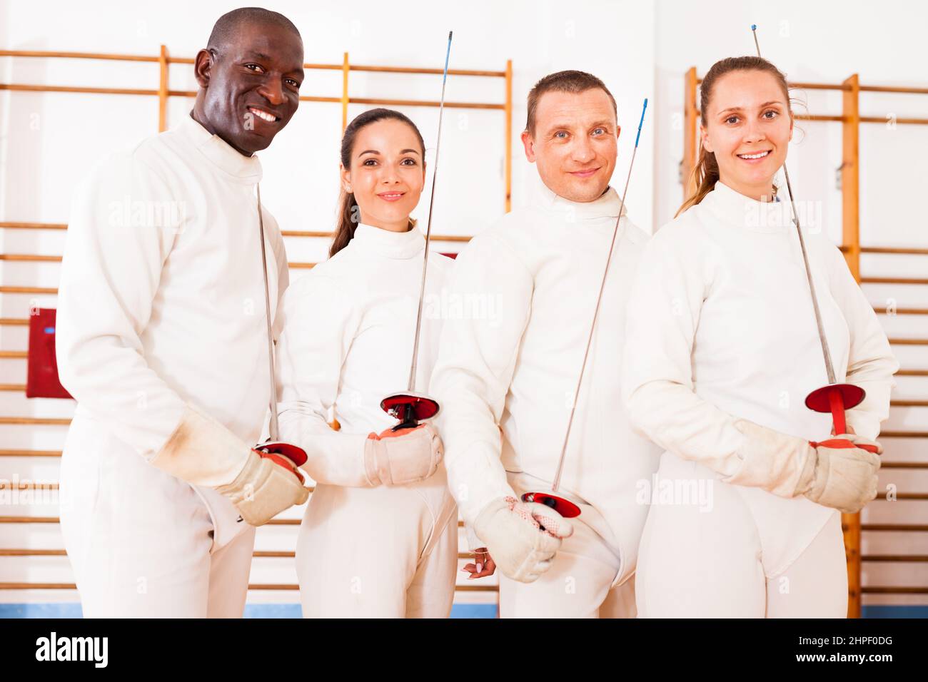 Men and women fencers posing with foils together Stock Photo - Alamy