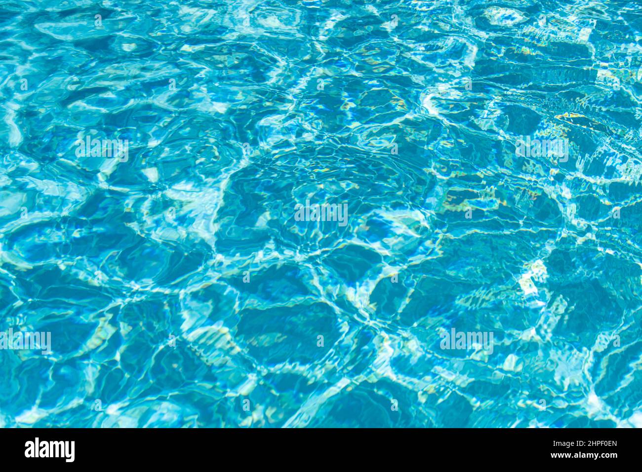 Abstract ripple wave and clear turquoise water surface in swimming pool ...