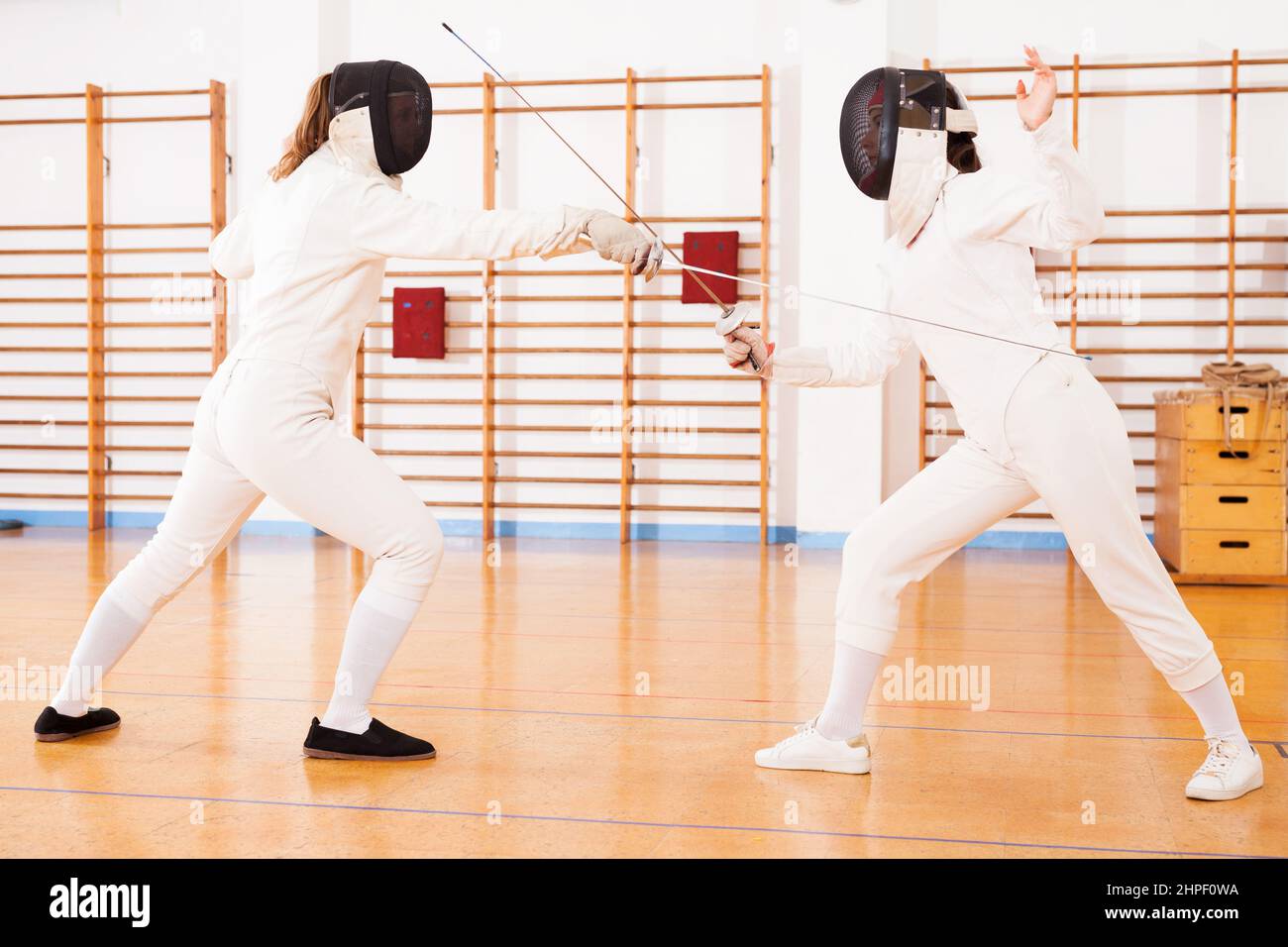 female athletes practicing movements at fencing battle Stock Photo - Alamy