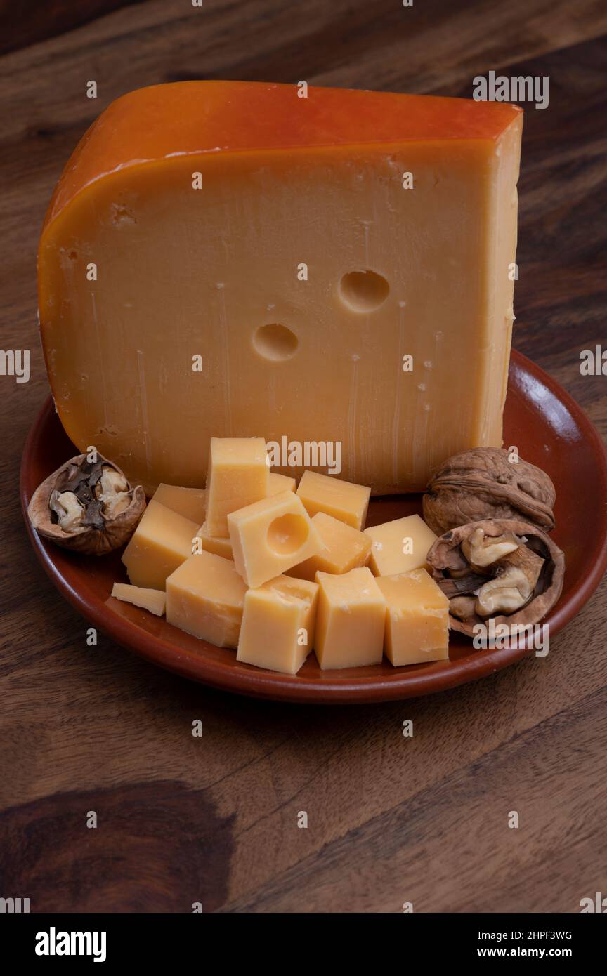 Dutch hard cow milk old yellow cheese from Gouda Stock Photo - Alamy