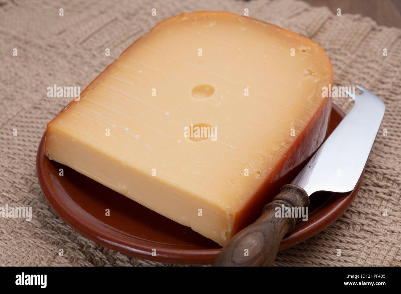 Dutch hard cow milk old yellow cheese from Gouda Stock Photo - Alamy