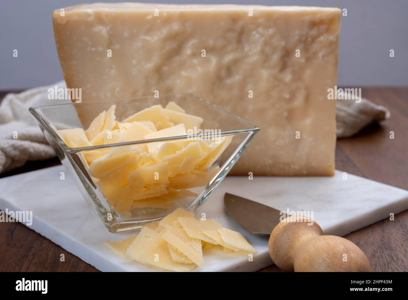Flakes of parmesan cheese, italian hard parmigiano-reggiano cheese from ...