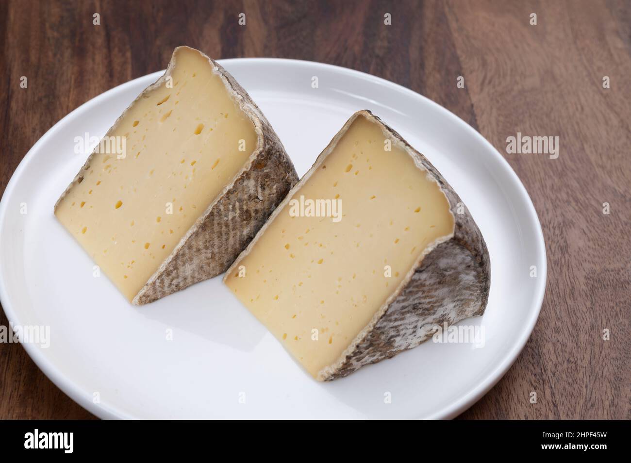 French mountain cheese from Alps, tomme de Savoie, close up Stock Photo ...
