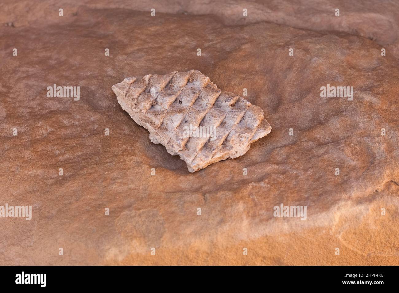 A potsherd of Ancestral Puebloan corrugated pottery found in Chaco ...