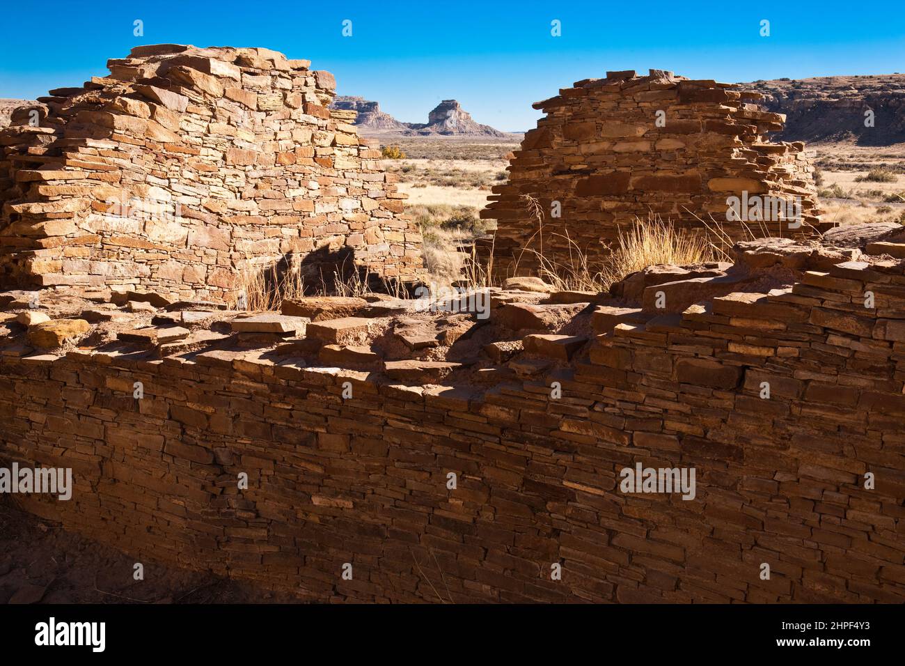 Fajada Butte seen through the Ancestral Puebloan ruins of a pueblo in ...