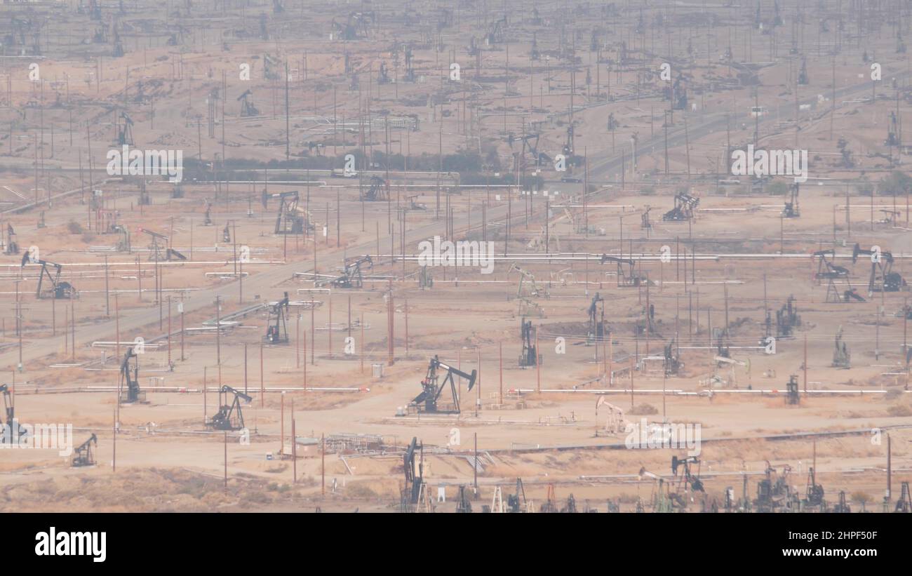 Wells with pump jacks on oil field, California USA. Rigs for crude ...