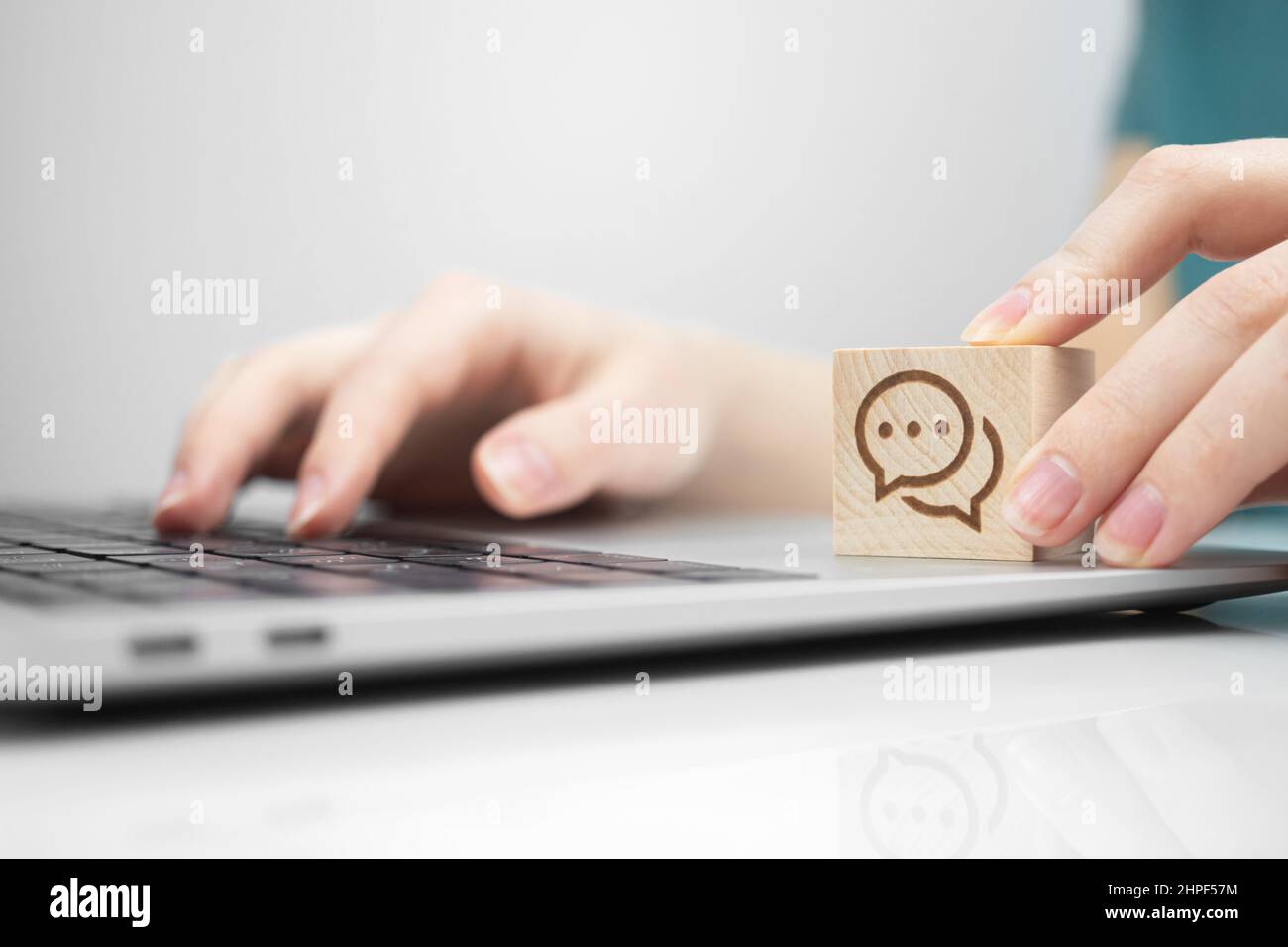 Customer support and IT service assist. Wooden cube with speech bubble ...