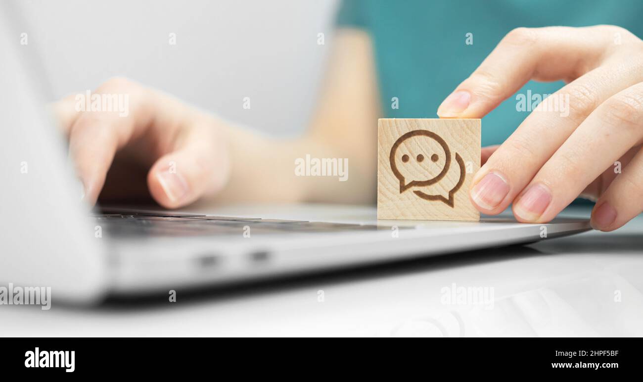 Customer support and IT service assist. Wooden cube with speech bubble ...