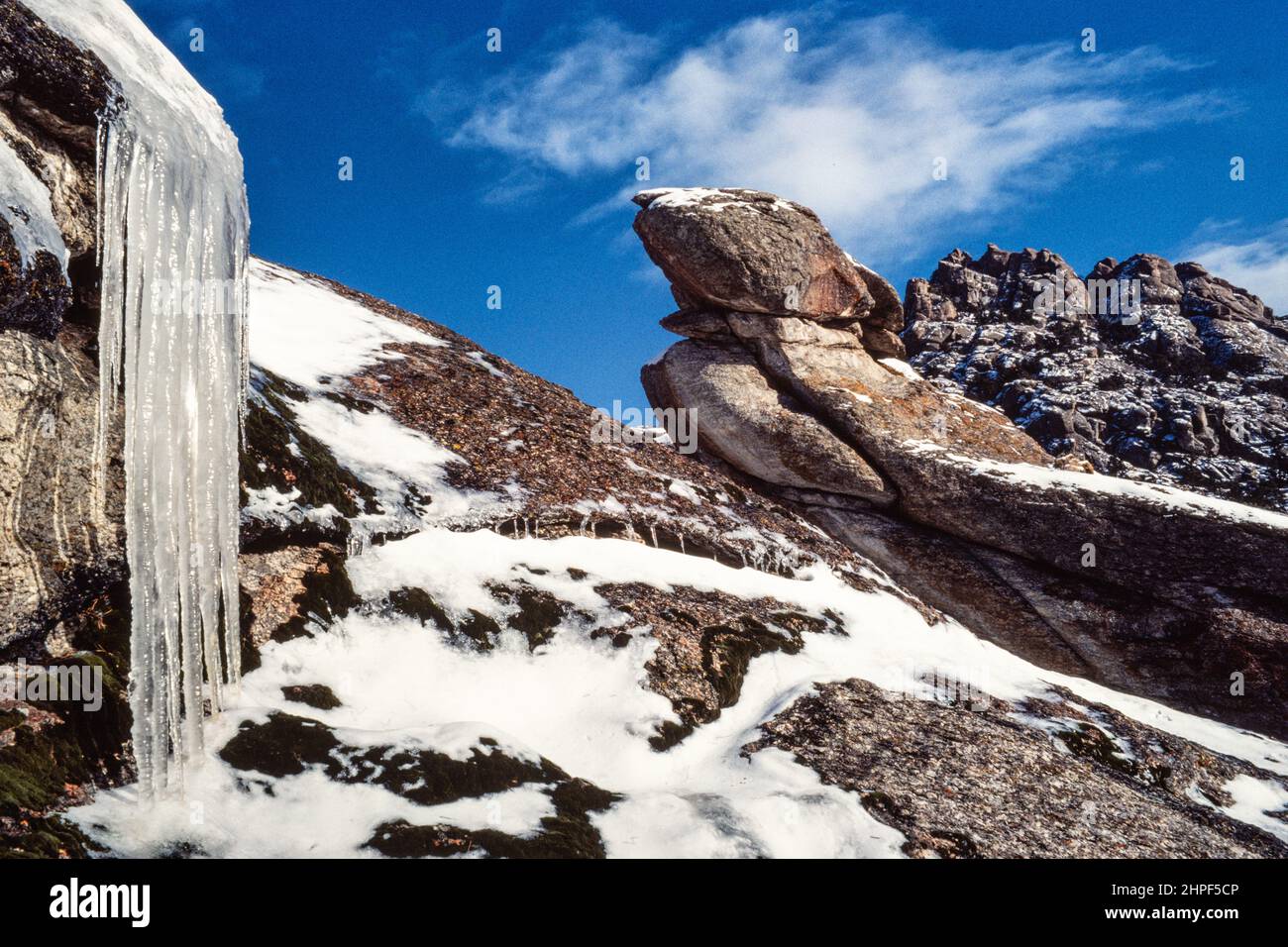 Snow and frozen icicles on the rocks at the City of Rocks National ...