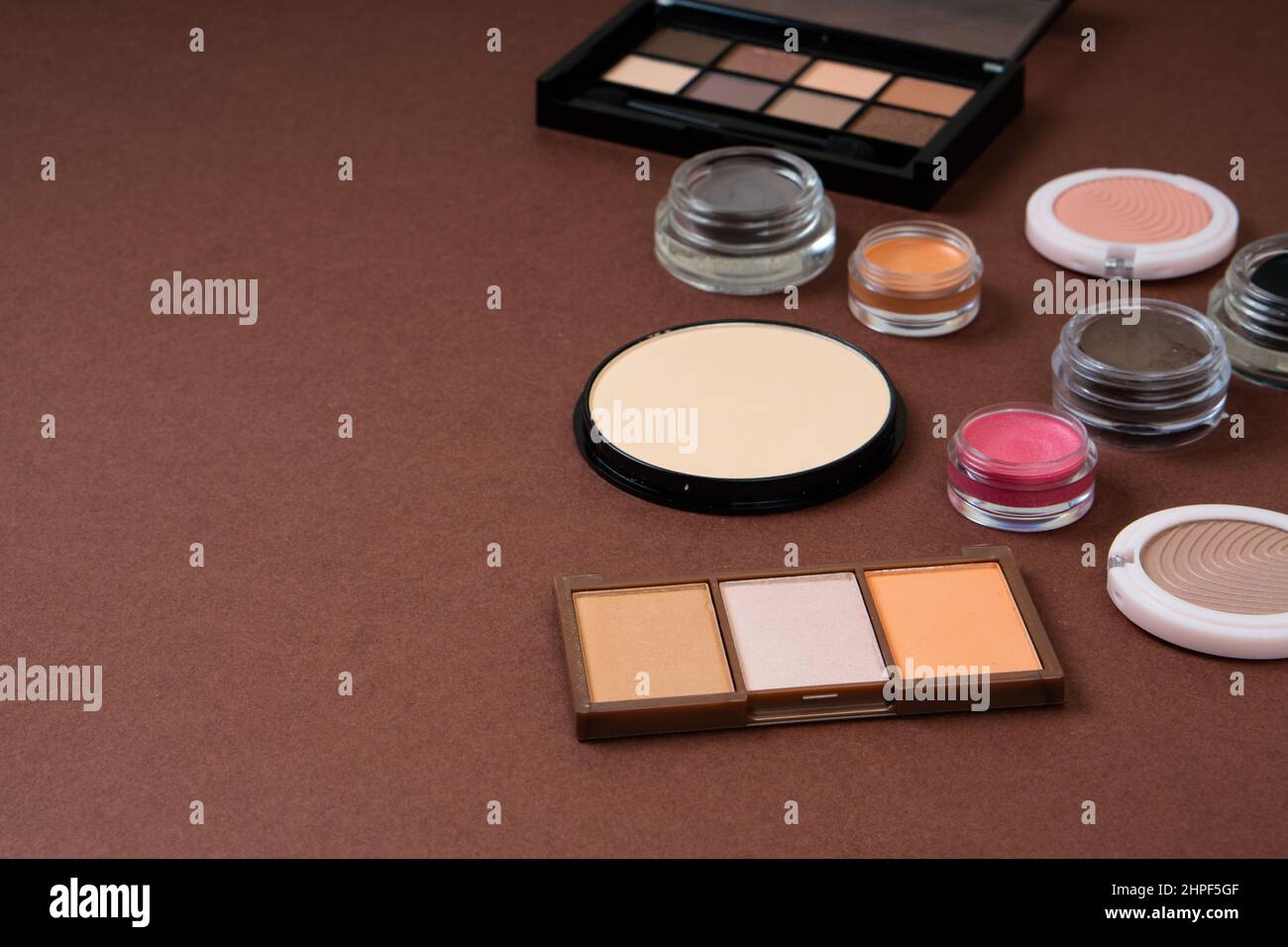 Group of cosmetic and makeup products on studio background Stock Photo ...