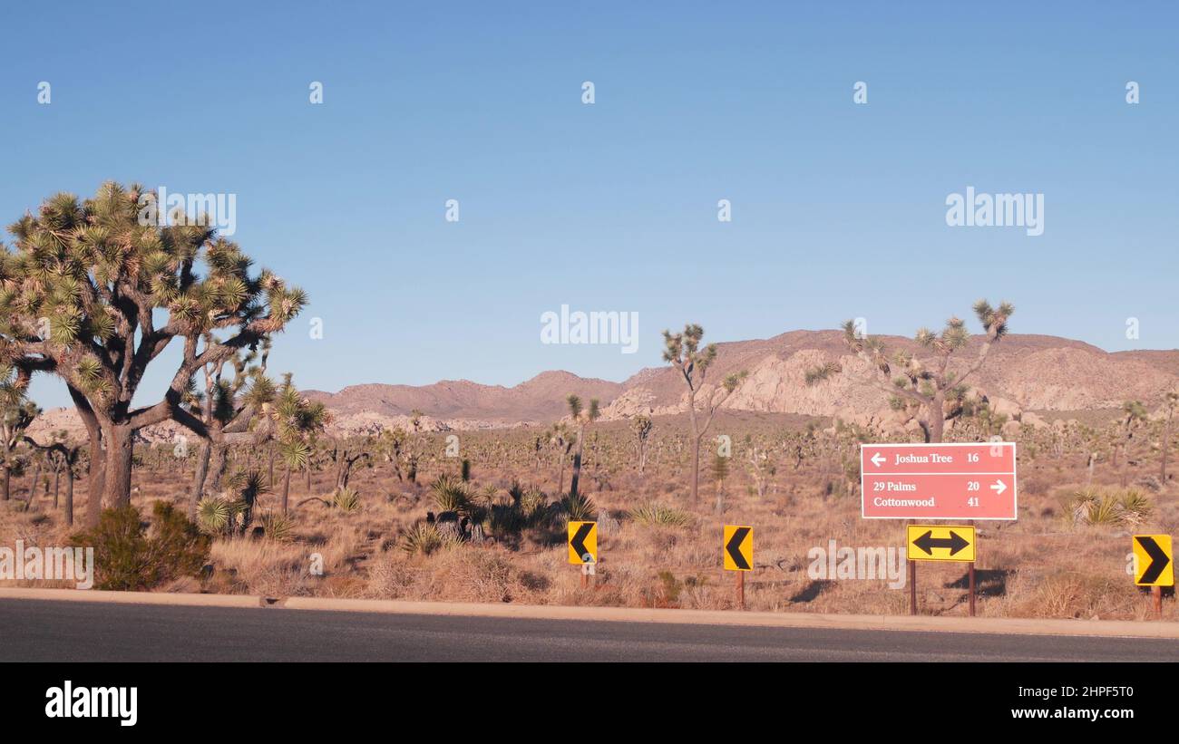 Crossroad sign with direction arrows on road intersection, California ...