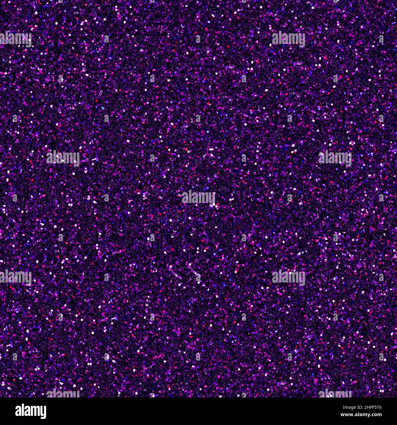 Holographic violet, purple, fuchsia, magenta glitter, sparkle confetti texture. Christmas ...