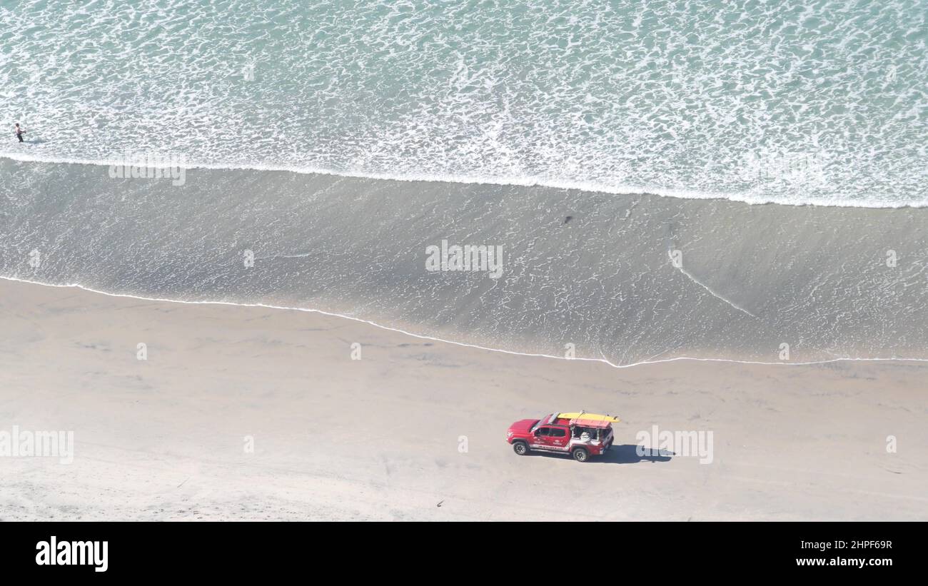 Lifeguard red pickup truck, life guard auto on sand, California ocean ...