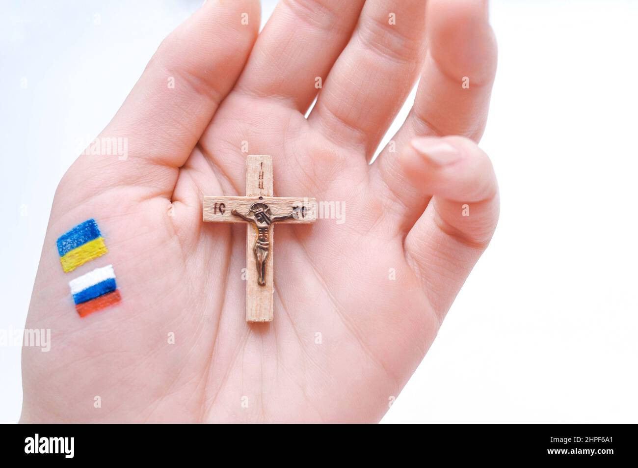 Orthodox Christ and drawned Russian and Ukrainian flags in hand Stock ...