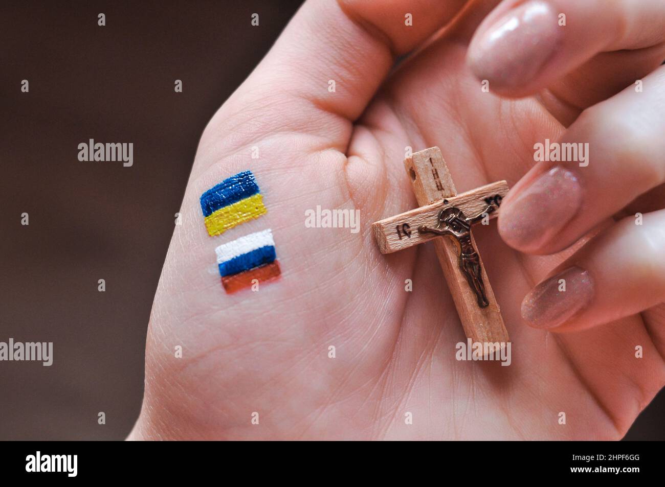 Orthodox Christ and drawned Russian and Ukrainian flags in hand Stock ...